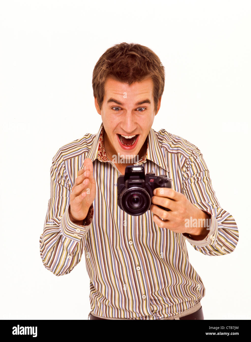 Young good looking white man with a digital camera, showing various ...