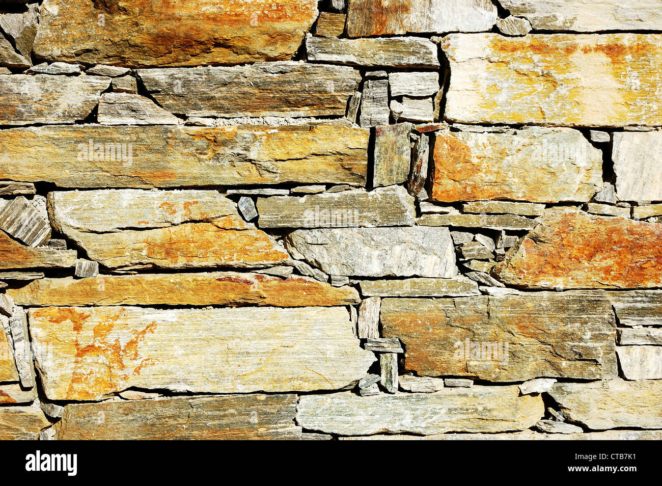 Detail of a colorful stone wall Stock Photo - Alamy