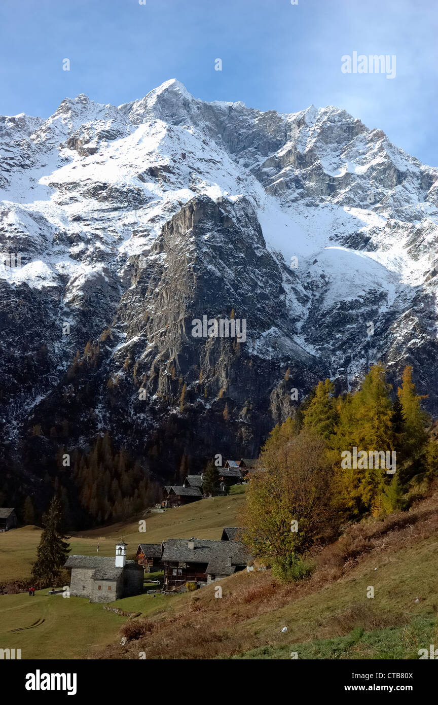 Mountain village during fall season; west Alps, Italy Stock Photo - Alamy