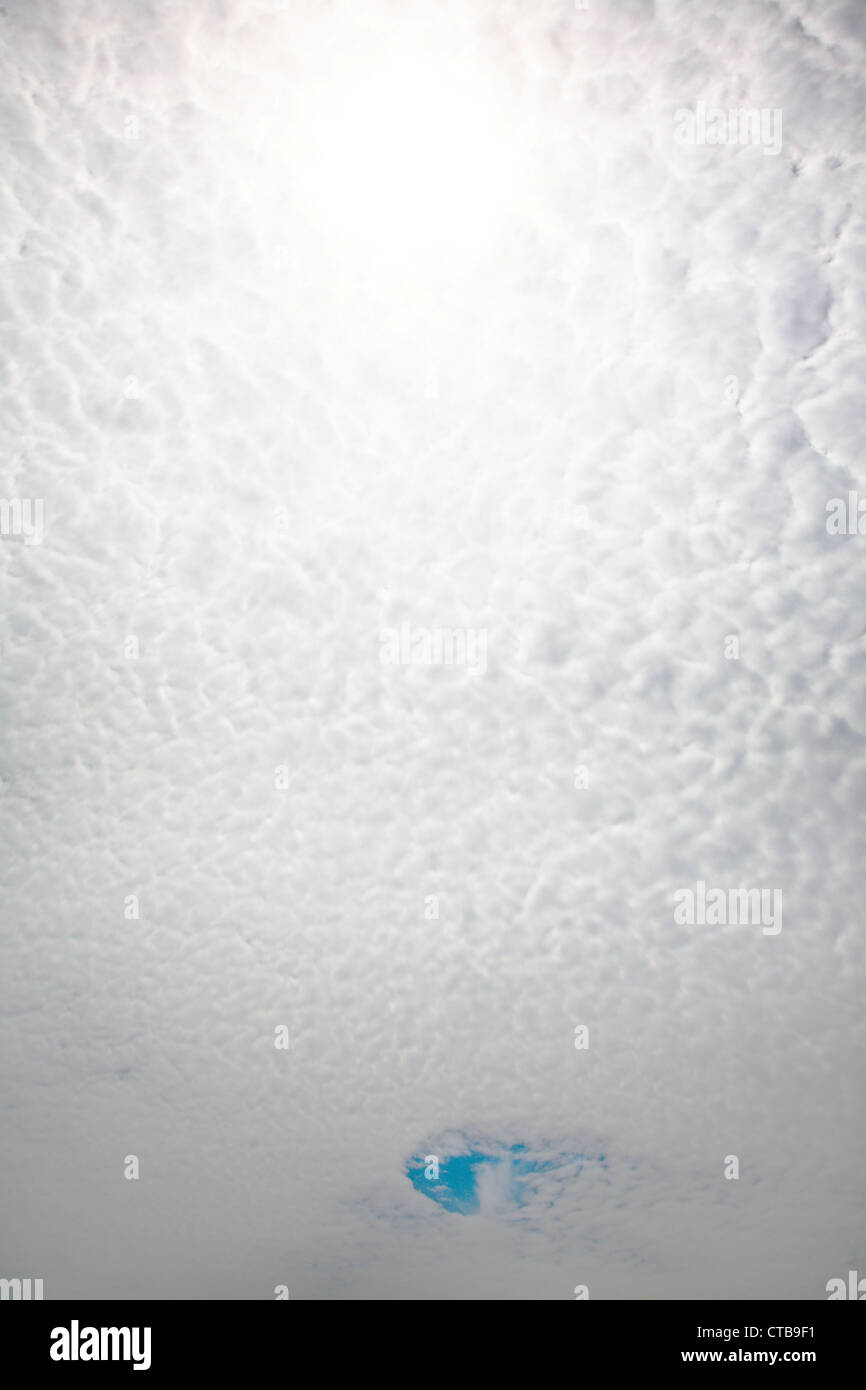 Cloudscape: small clouds and a piece of sky, vertical orientation Stock ...