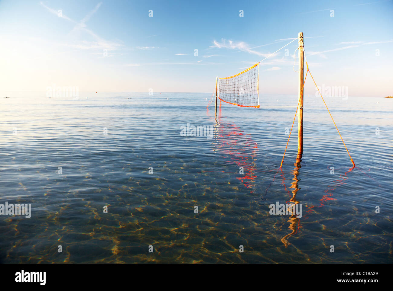 Beach Volleyball net in low water, horizontal frame Stock Photo - Alamy