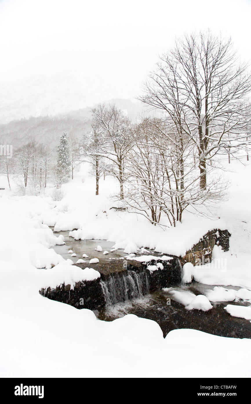Winter scenic: mountain river in a snowy field Stock Photo - Alamy