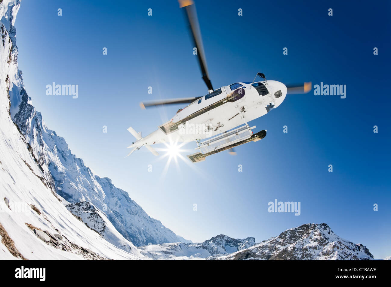 Heli Skiing Helicopter is landing on a ski slope in Gressoney Ski ...