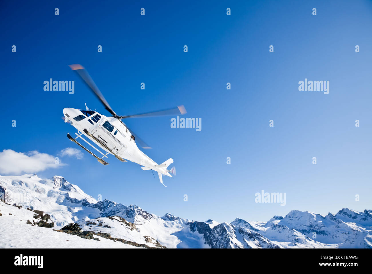 Heli Skiing Helicopter is landing on a ski slope in Gressoney Ski ...