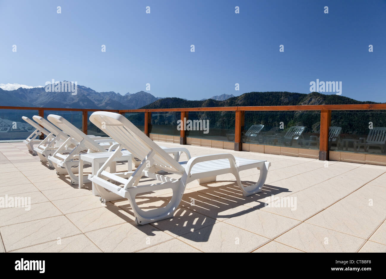 Sun beds in the solarium of a mountain resort Stock Photo - Alamy