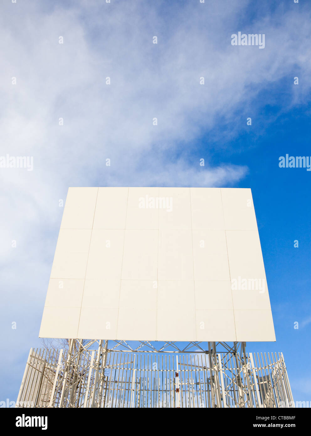A white passive TV repeater over blue sky Stock Photo - Alamy