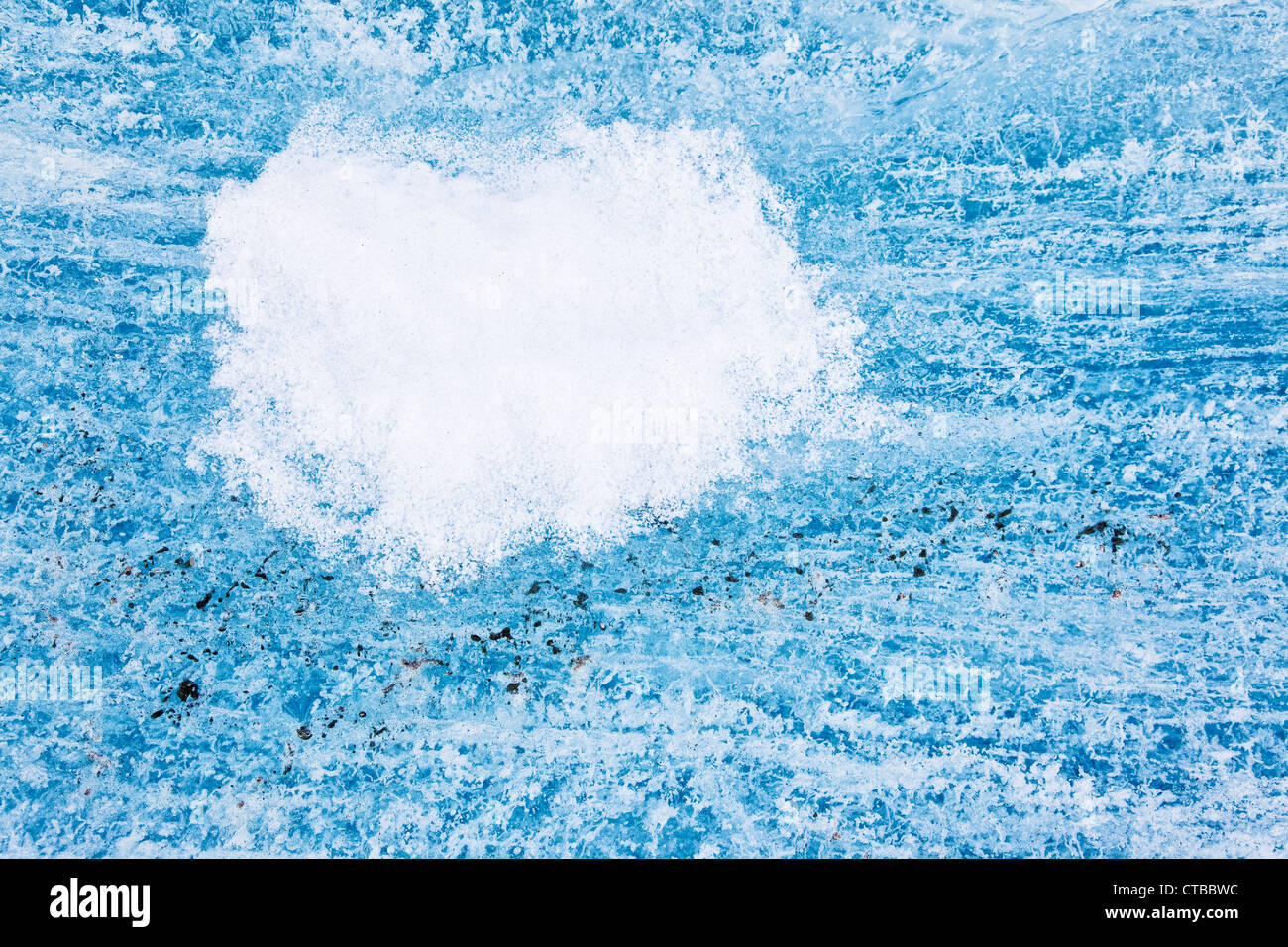 Ice, natural background. Part of an alpine glacier with a spot of snow ...