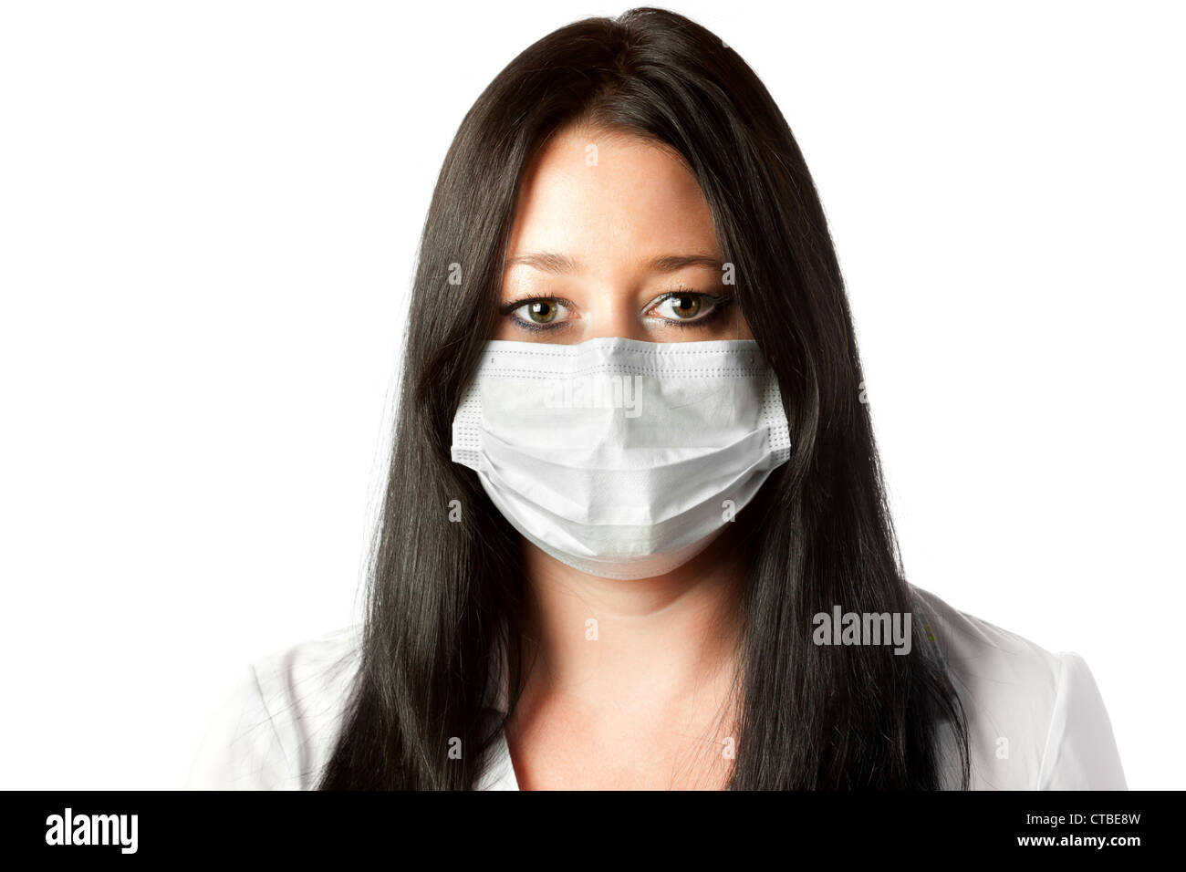 attractive female brunette nurse in mask isolated on white background ...