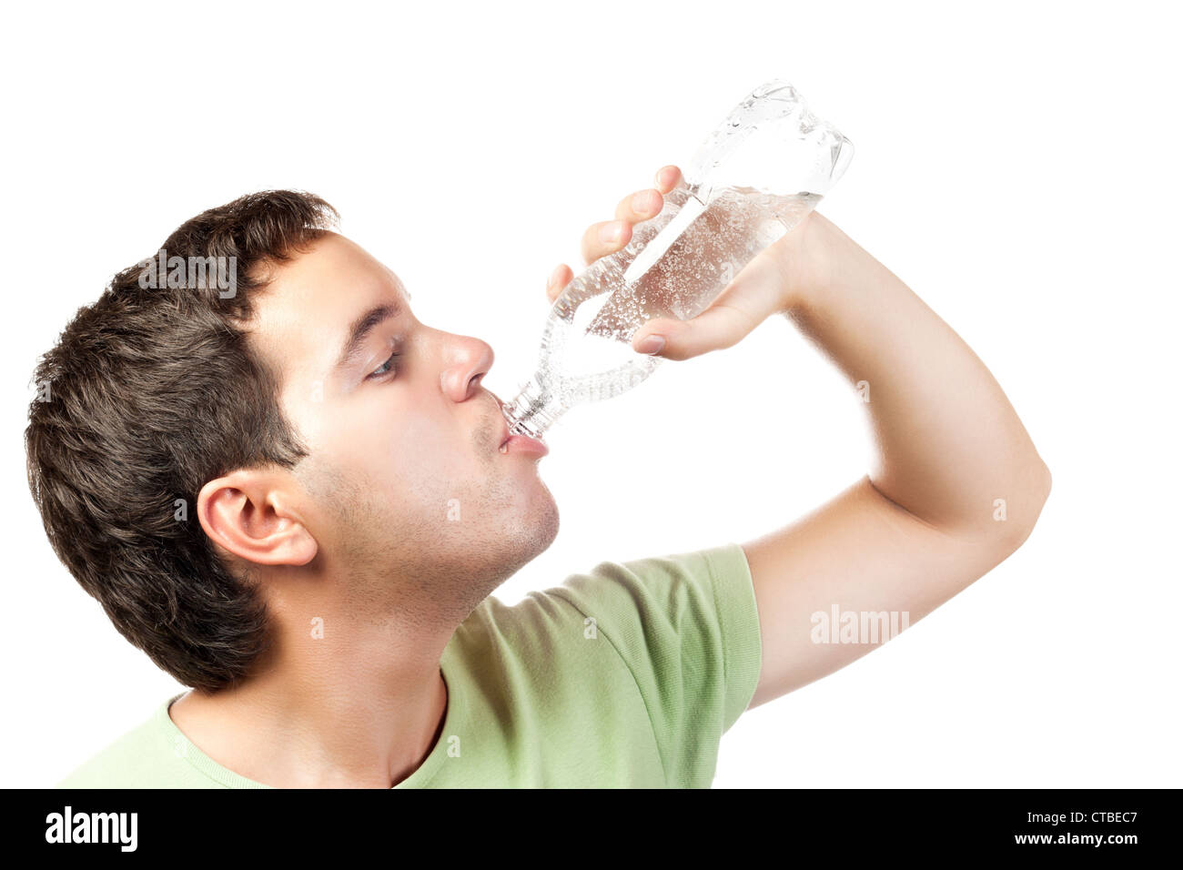 young man drinking water from bottle isolated on white background Stock ...