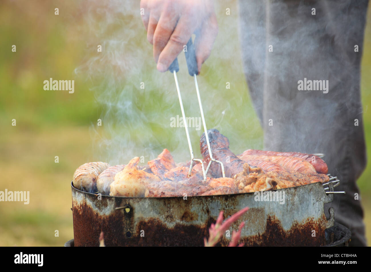 Barbecue with delicious grilled meat on grill BBQ Stock Photo - Alamy