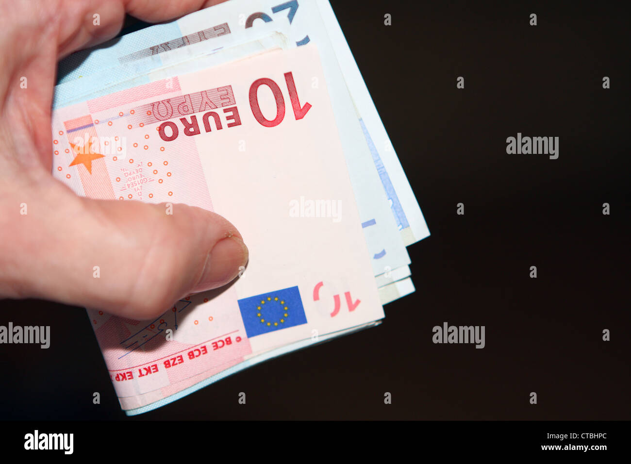 a hand holding euro notes Stock Photo - Alamy