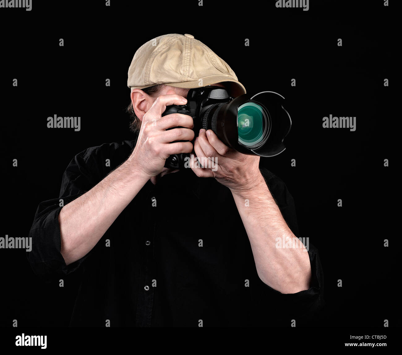A photographer with a nice camera on black background Stock Photo - Alamy