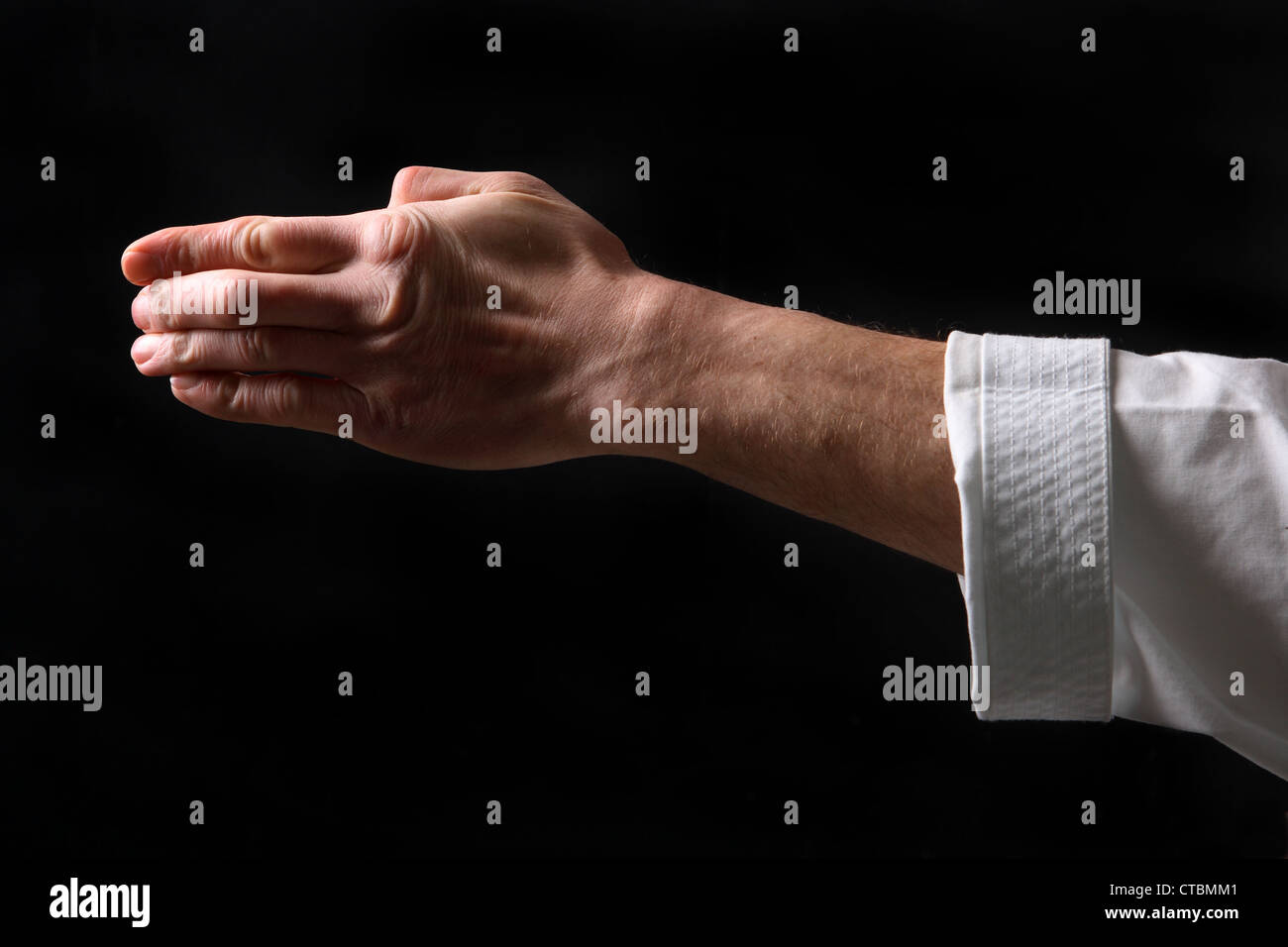 Fist. Hand fighter karate on the black background Stock Photo - Alamy