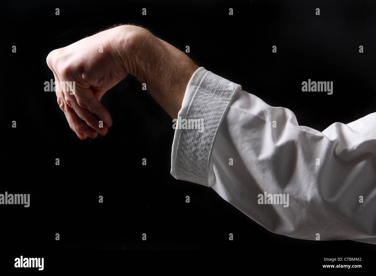 Fist. Hand fighter karate on the black background Stock Photo - Alamy