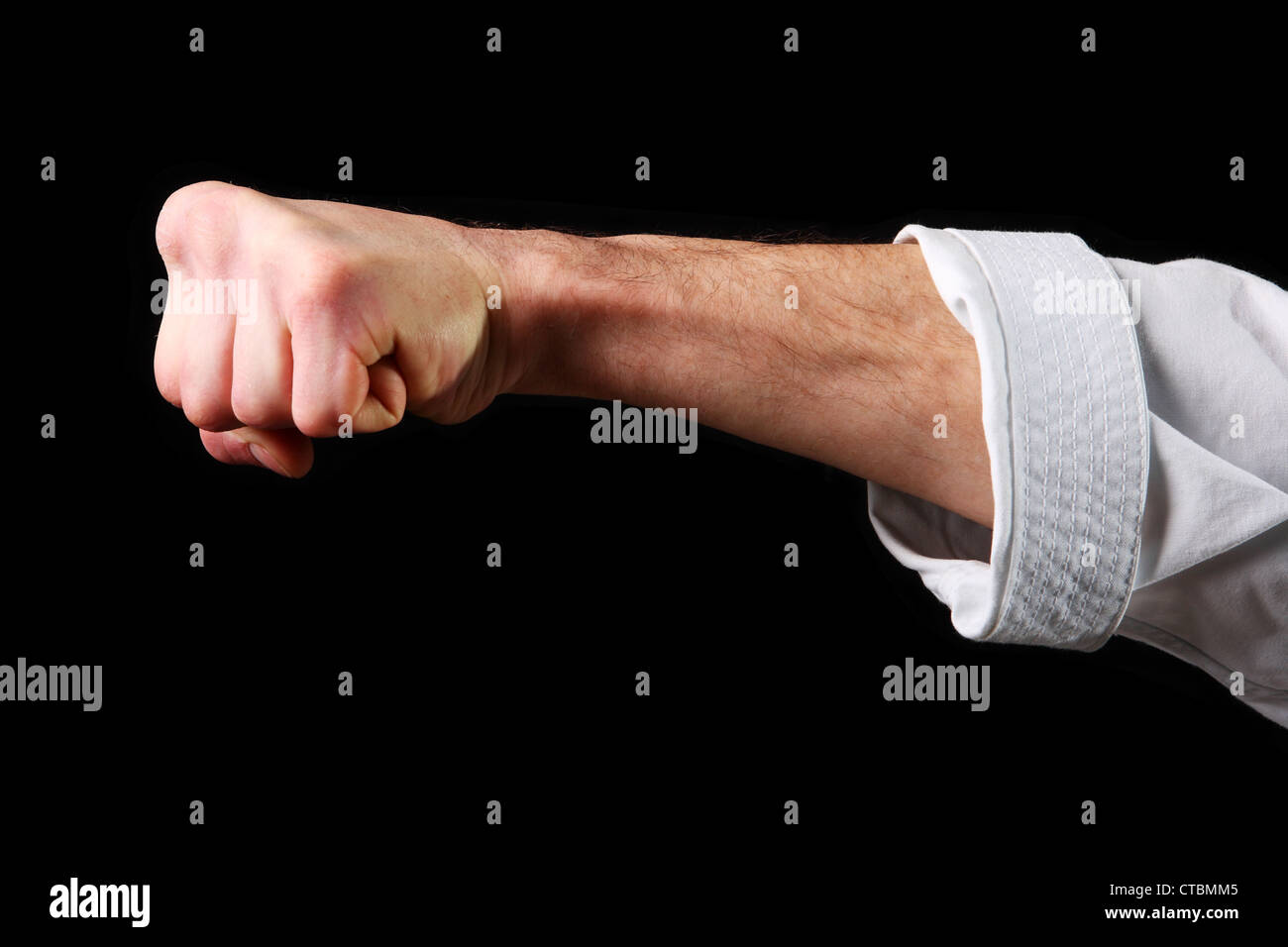Fist. Hand fighter karate on the black background Stock Photo - Alamy