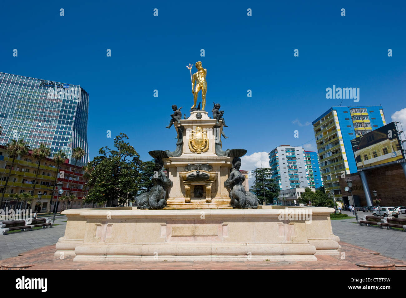 The gold-colored statue of Poseidon in Batumi, Georgia, one of the city ...