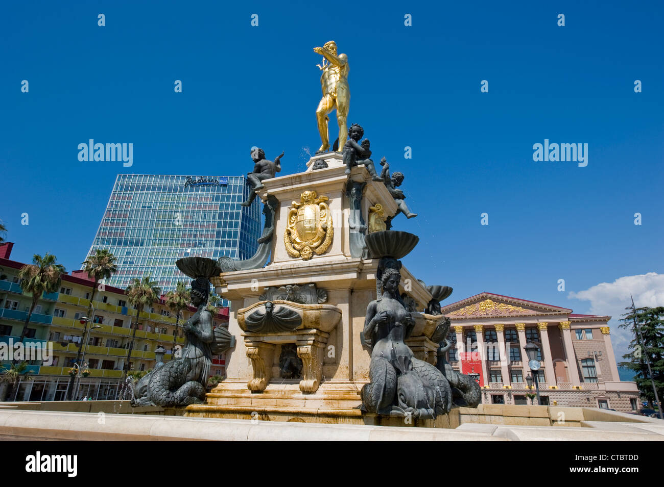 The gold-colored statue of Poseidon in Batumi, Georgia, one of the city ...