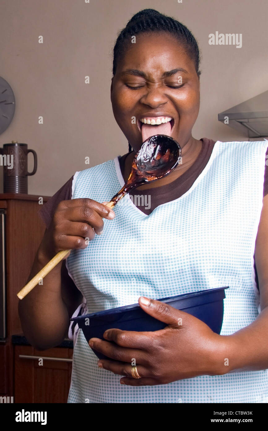 Woman licking spoon bowl hi-res stock photography and images - Alamy