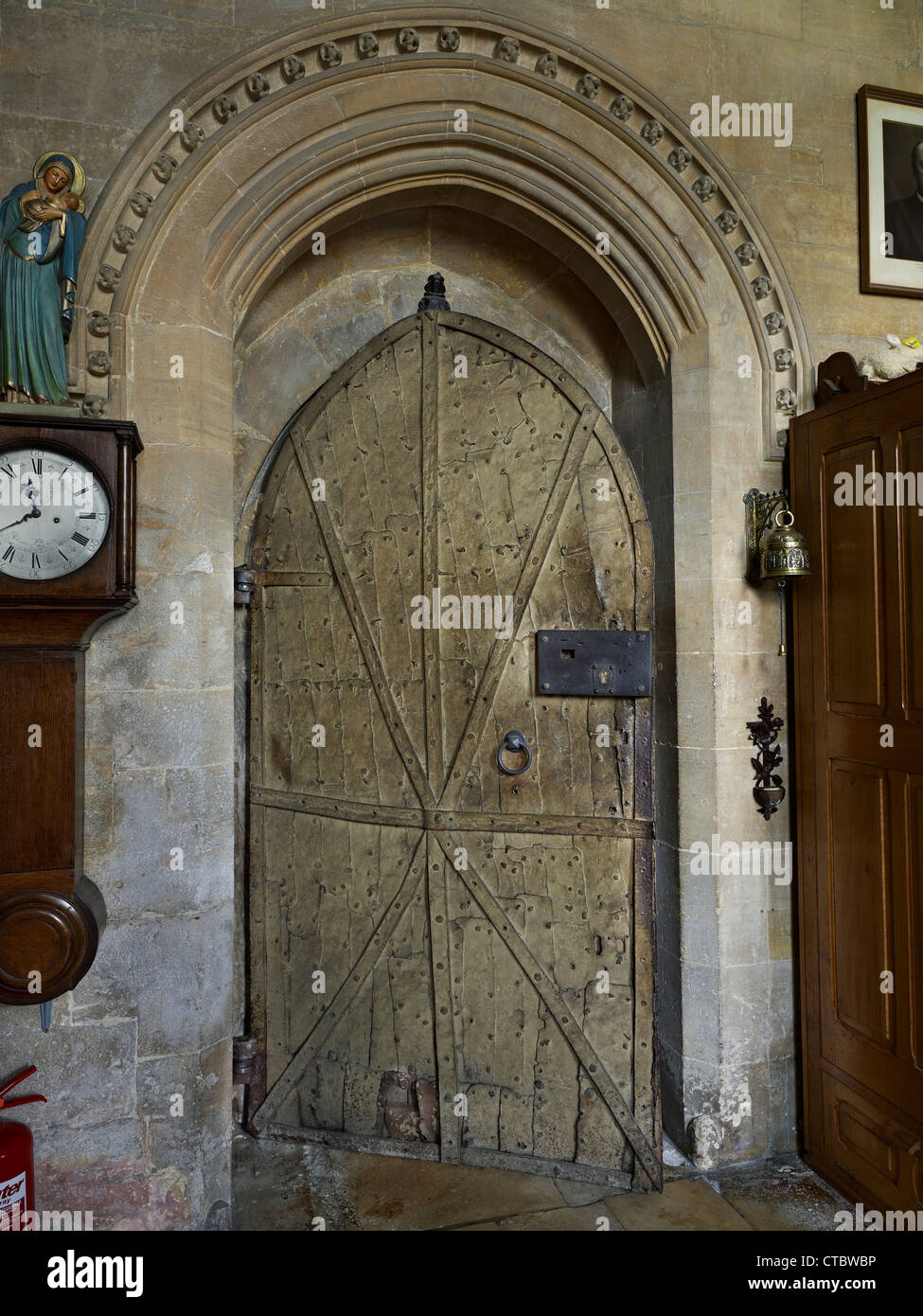 Tewkesbury Abbey sacristy door Stock Photo - Alamy