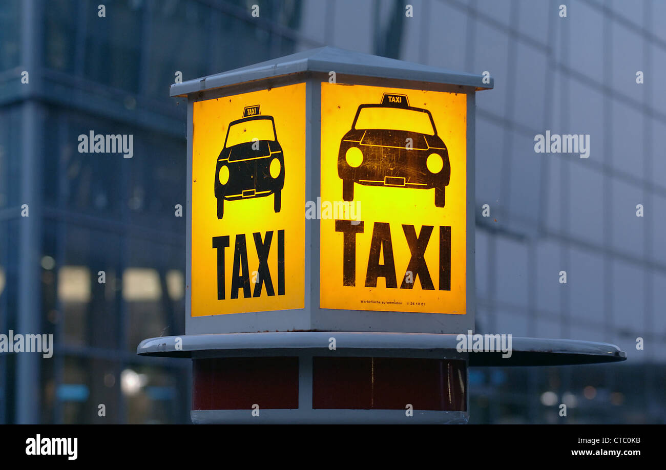 An illuminated sign at a taxi rank, Berlin Stock Photo - Alamy