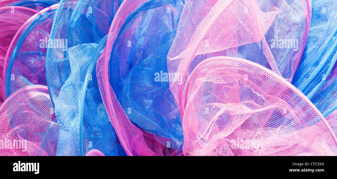 Child's fishing nets in blue and pink at a shop on Brighton seafront ...