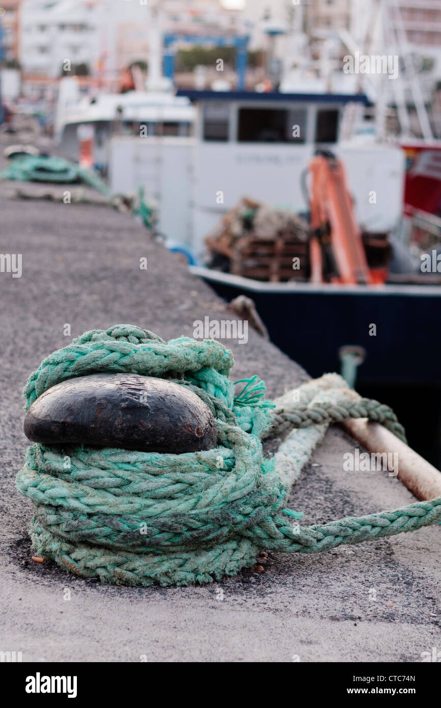 Mooring on a harbour and fishing boat tied up tenerife canary islands ...