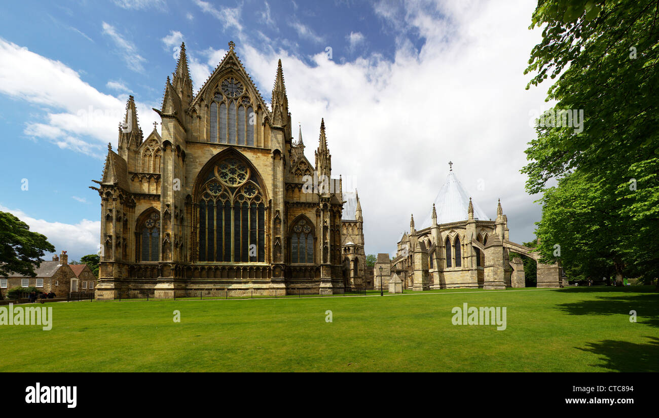 Rear view of Lincoln Cathedral showing flying buttresses and spires ...