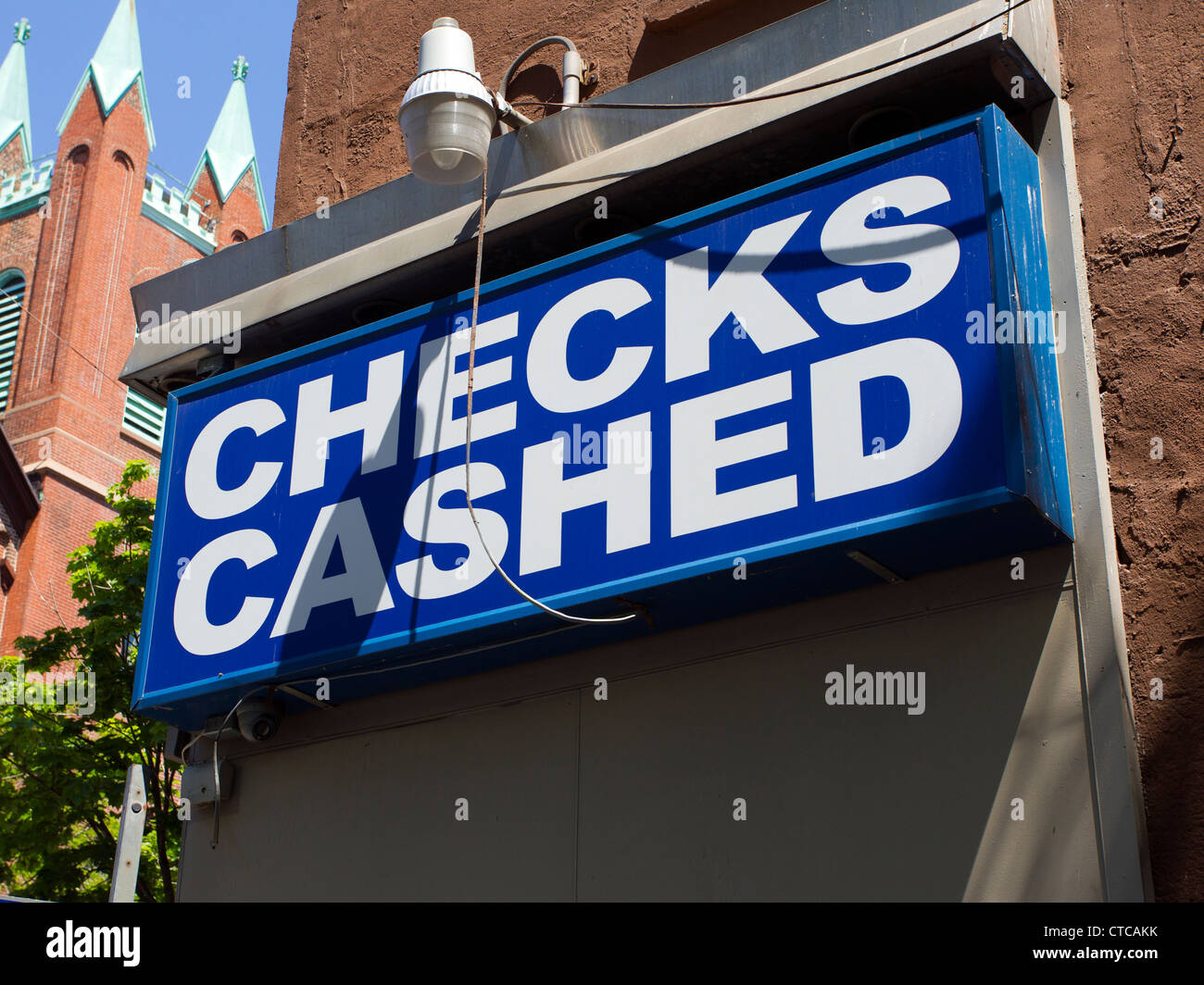 A checks cashed sign above a storefront Stock Photo - Alamy