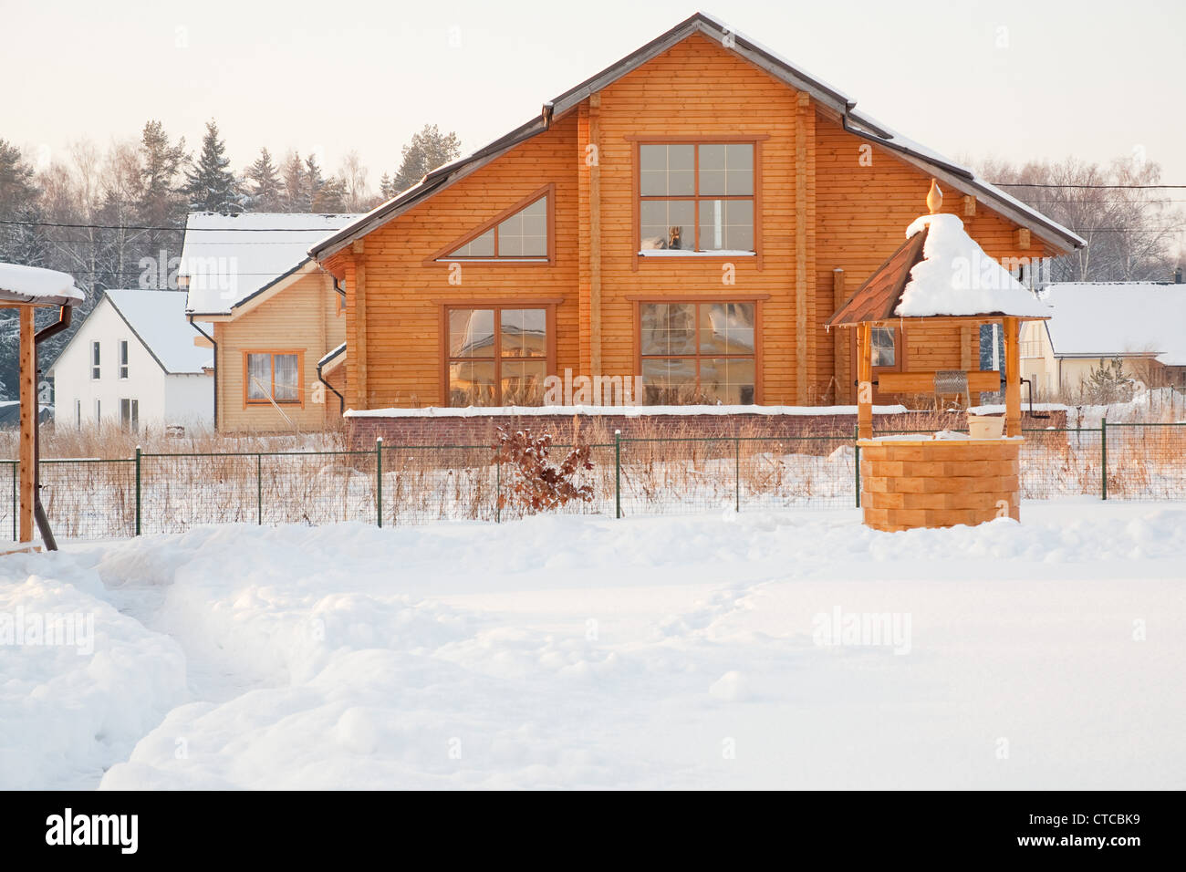 new wood country house in snowdrifts in winter Stock Photo - Alamy