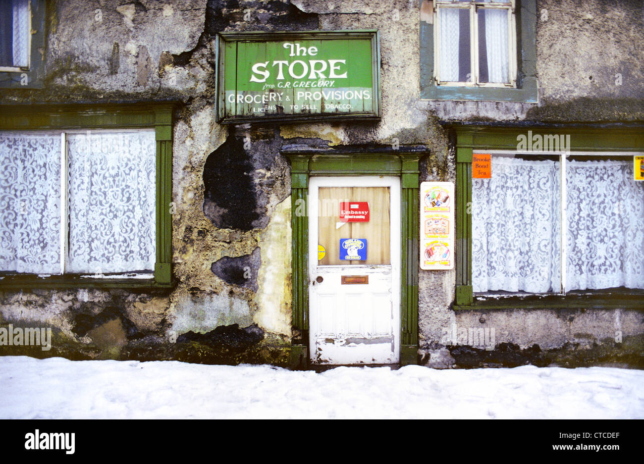 Old shop front door and windows, Castleton, Derbyshire, UK Stock Photo ...