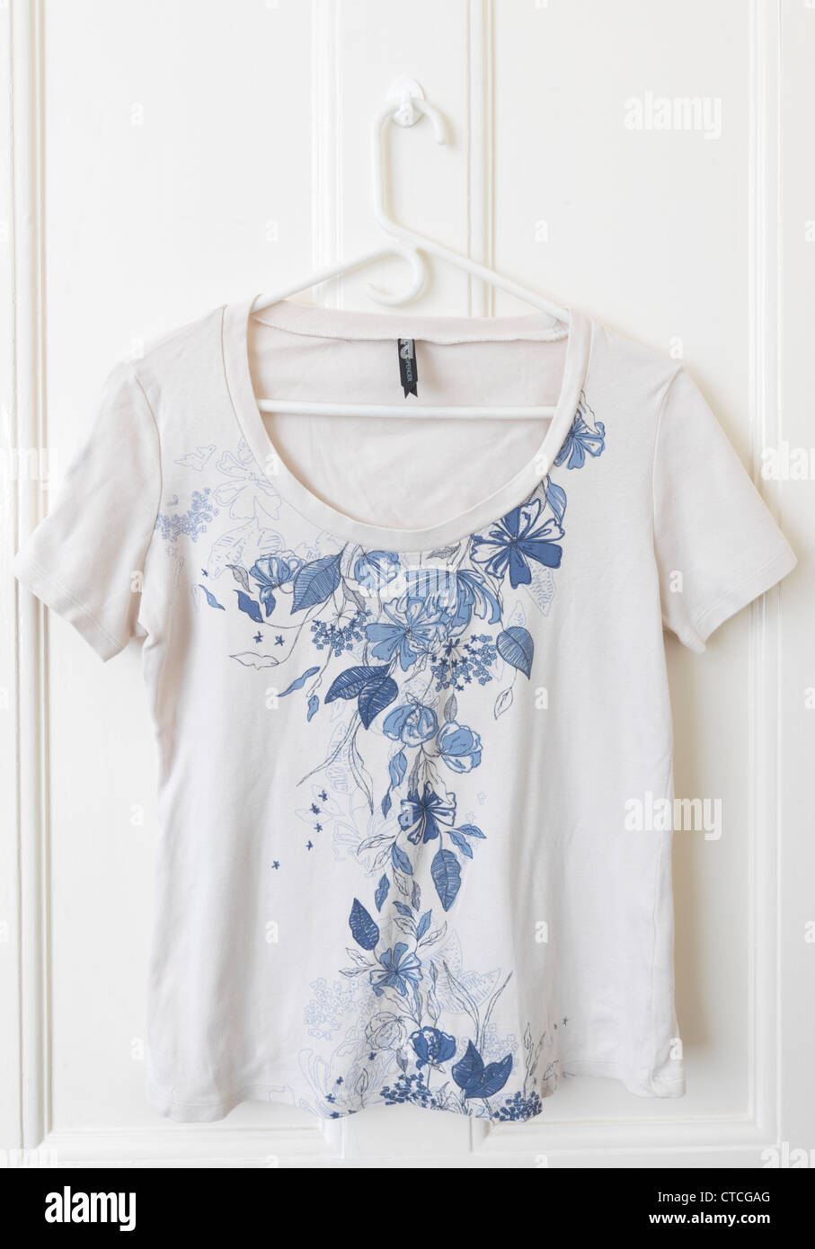 White Cotton T-Shirt With Blue Floral Pattern Stock Photo - Alamy