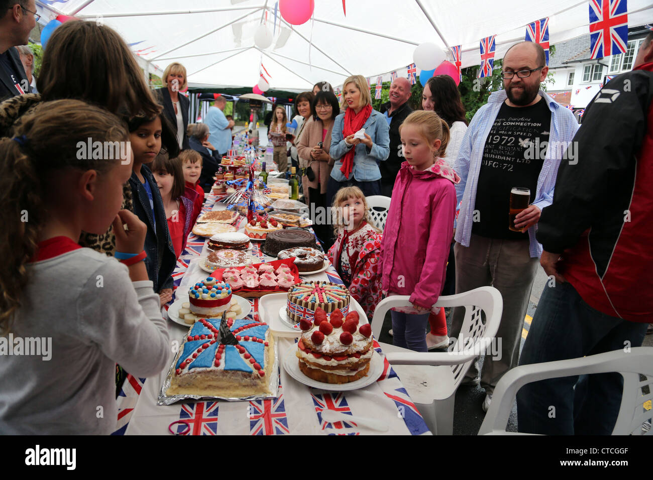 People Looking At Cakes During Cake Competition At Street Party During ...
