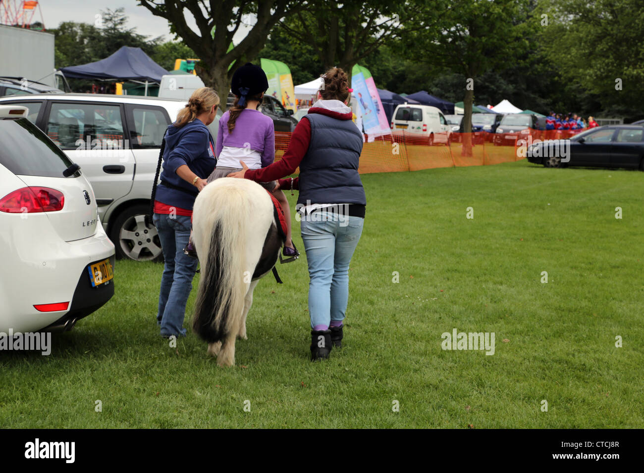 Woman rides pony hi-res stock photography and images - Alamy