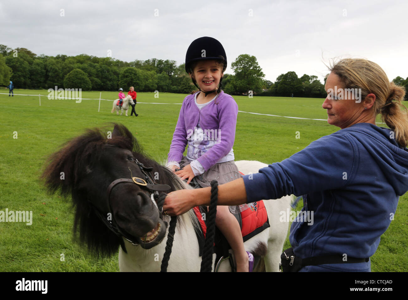 Pony Riding At Cheam Village Fair Surrey England Stock Photo - Alamy