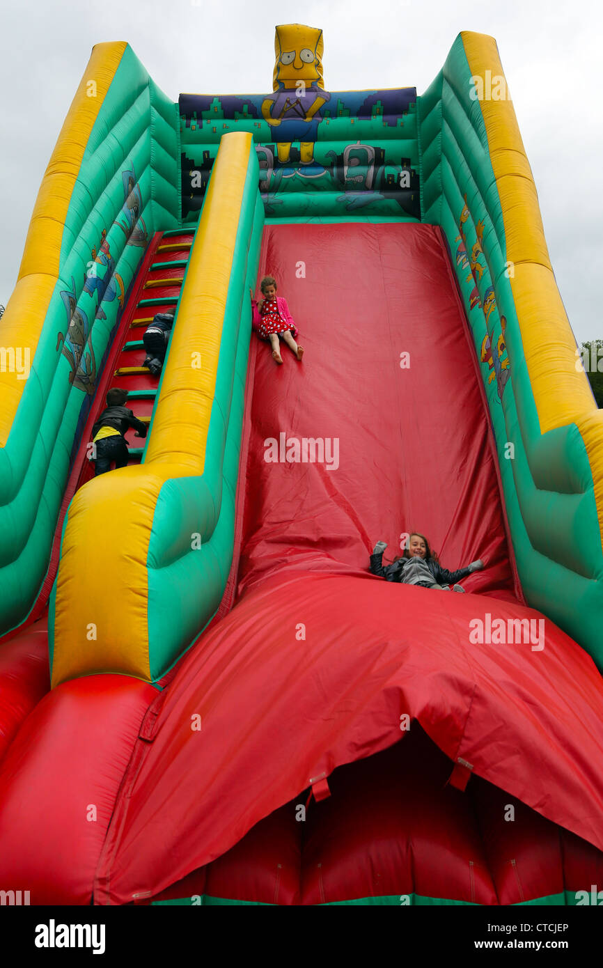 Children On The Simpsons Inflatable Slide Cheam Village Fair Surrey ...