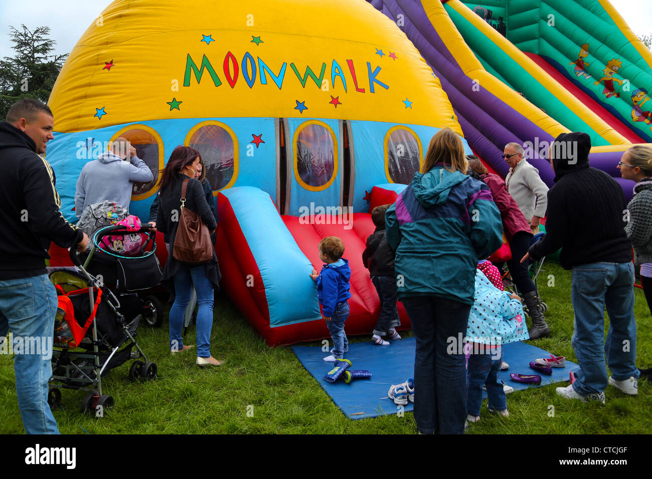Parents wait For Children Who Are On Moonwalk Bouncy Castle At Cheam ...