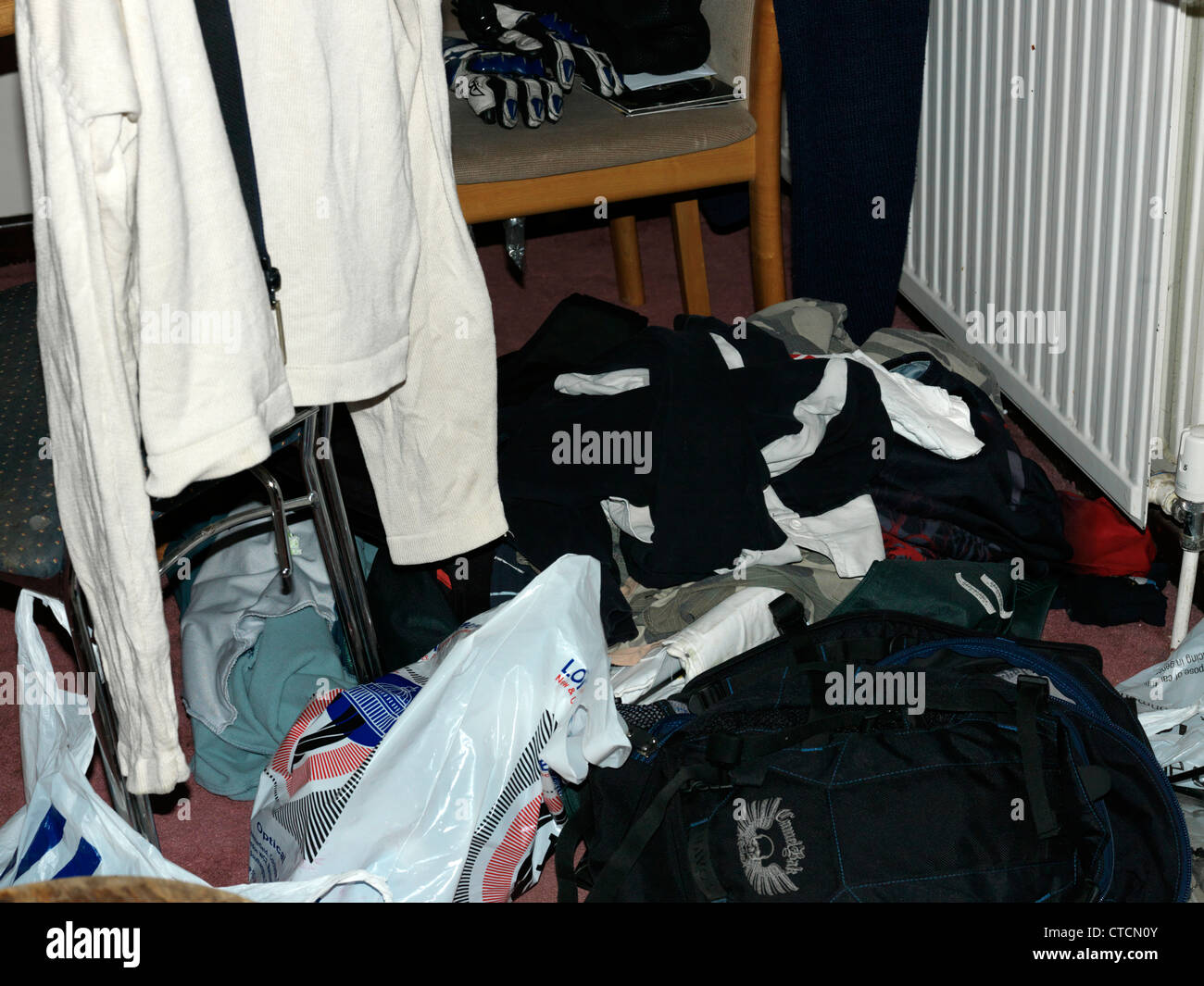 Pile of Clothes Left On the Floor Stock Photo - Alamy