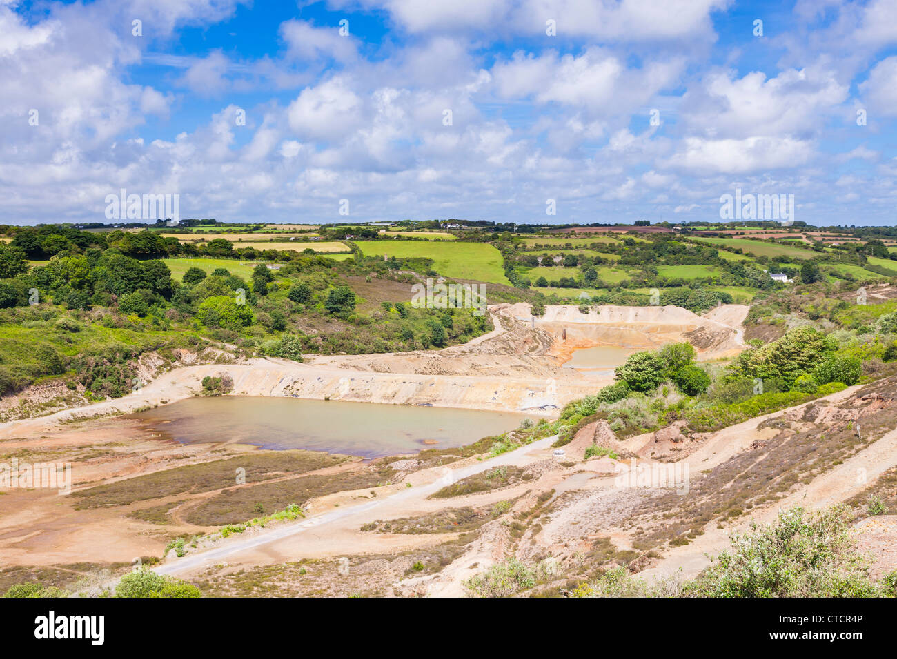 Abandoned mine and tailings dam at Wheal Maid Valley Cornwall England ...