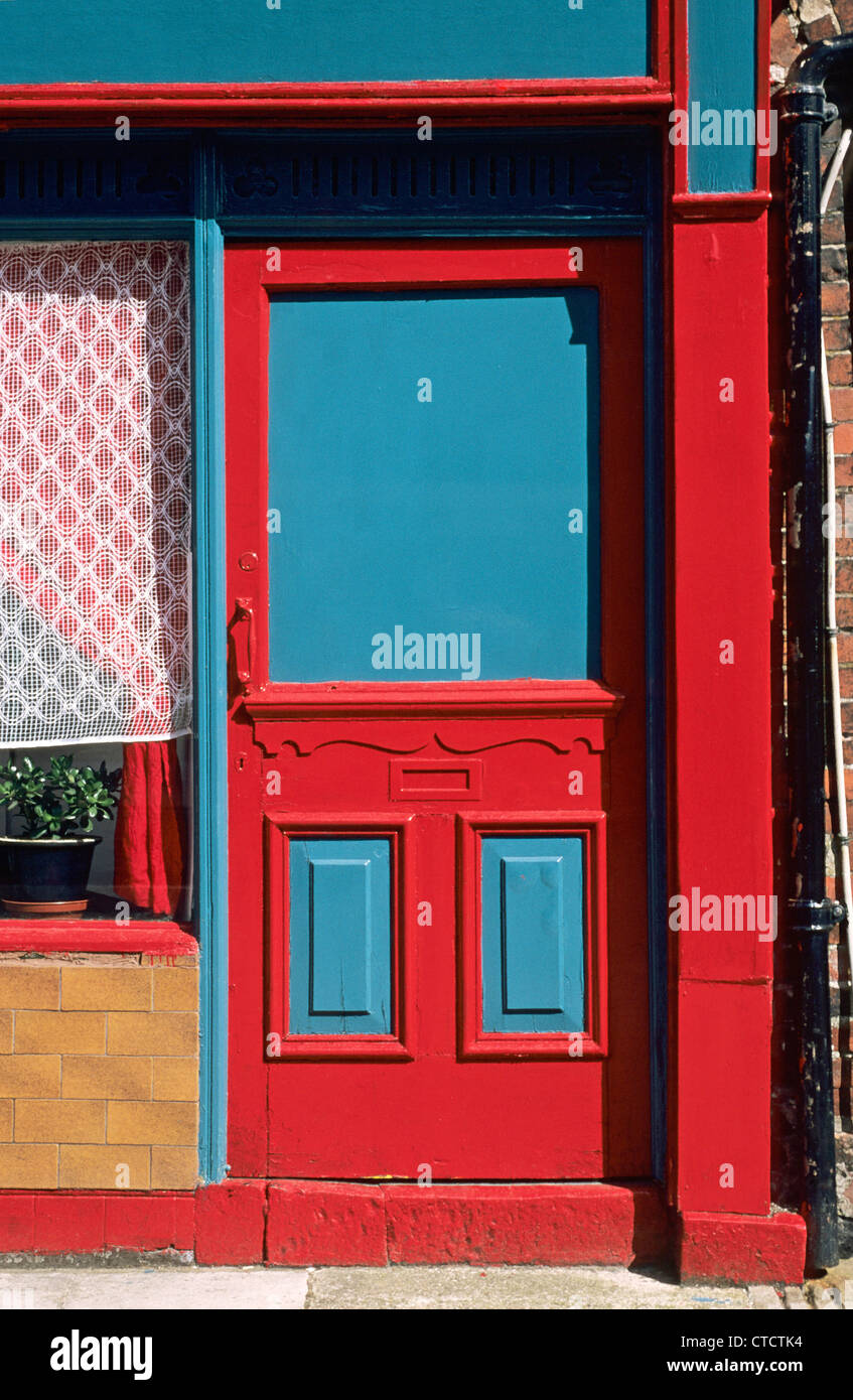 Red and blue shop front door, Llanidloes, Powys, Wales, UK Stock Photo ...