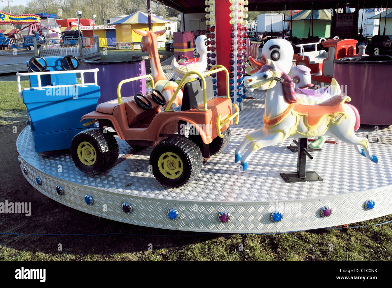 childrens ride at fairground Stock Photo - Alamy