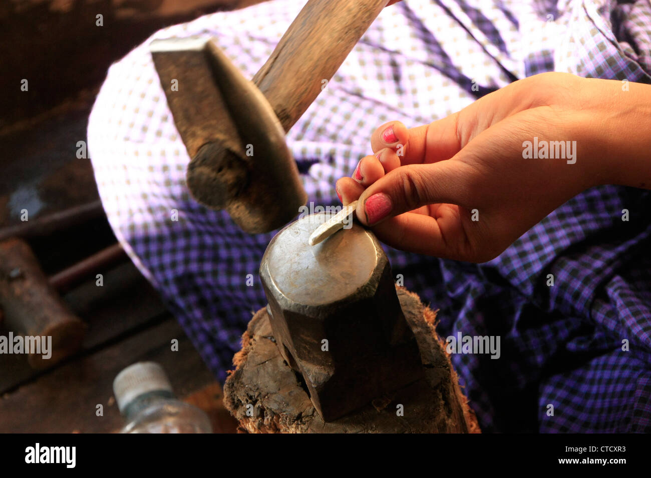 Close up of pounding silver for jewelry production, Inle lake, Shan ...
