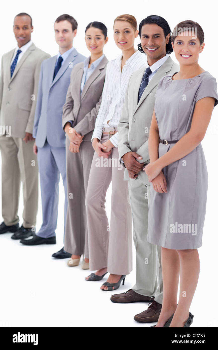 Colleagues smiling looking straight Stock Photo - Alamy
