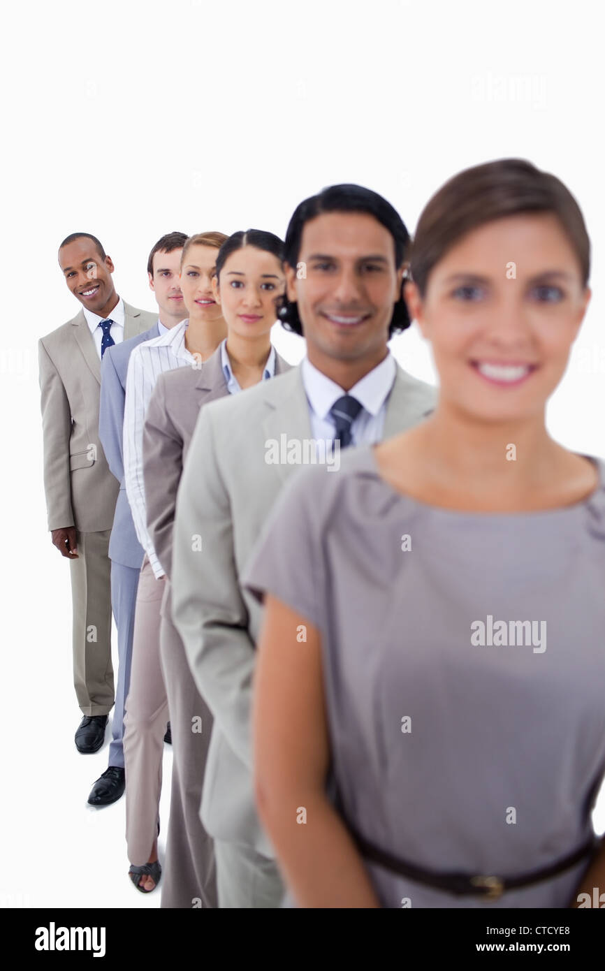 Close-up of workmates in a single line looking straight Stock Photo - Alamy