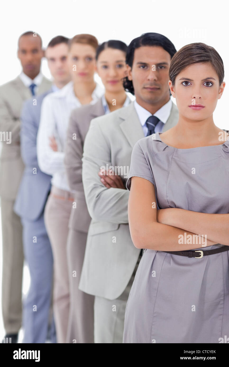 Close-up of serious workmates in single a line Stock Photo - Alamy