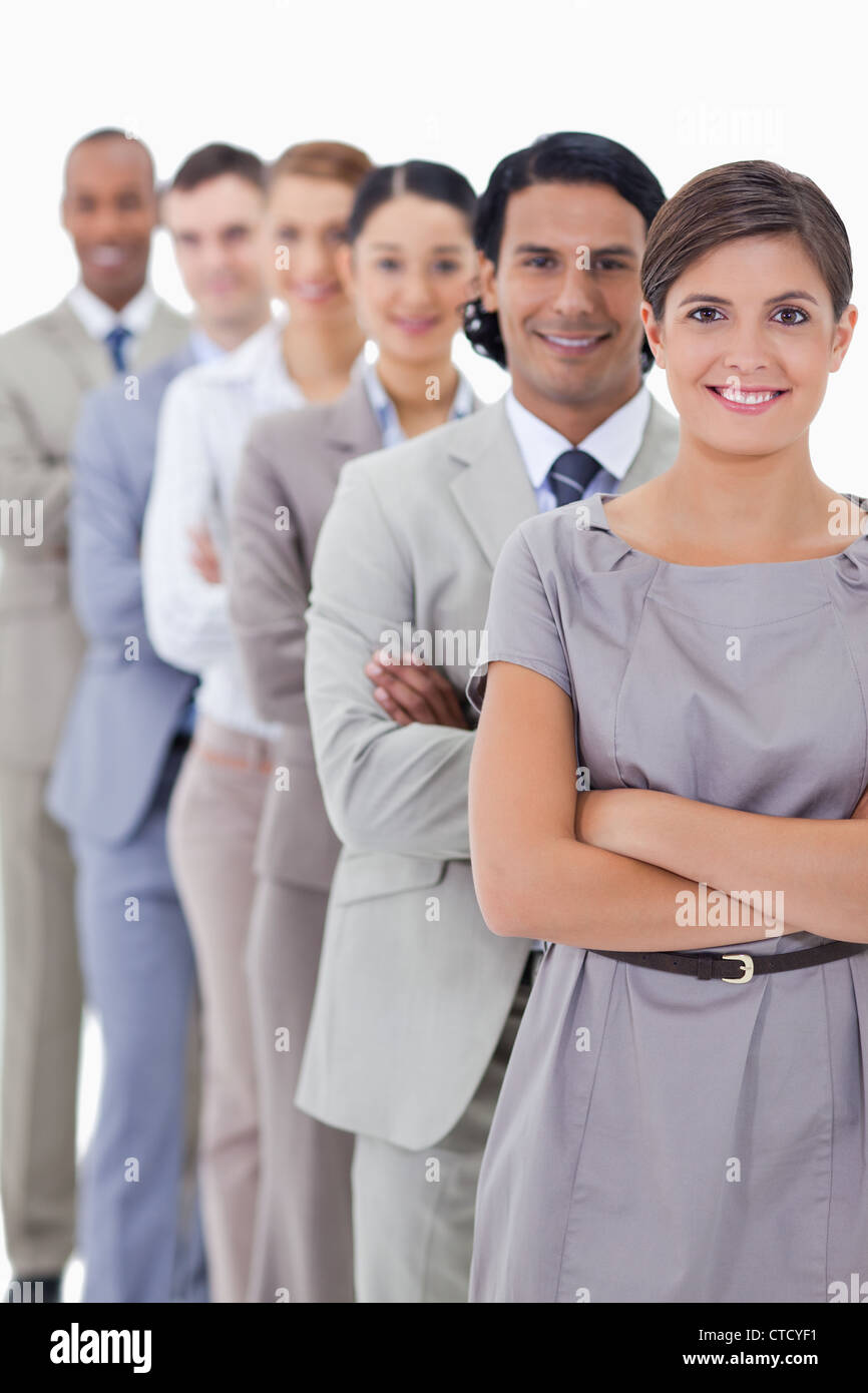 Close-up of workmates smiling in a single line Stock Photo - Alamy