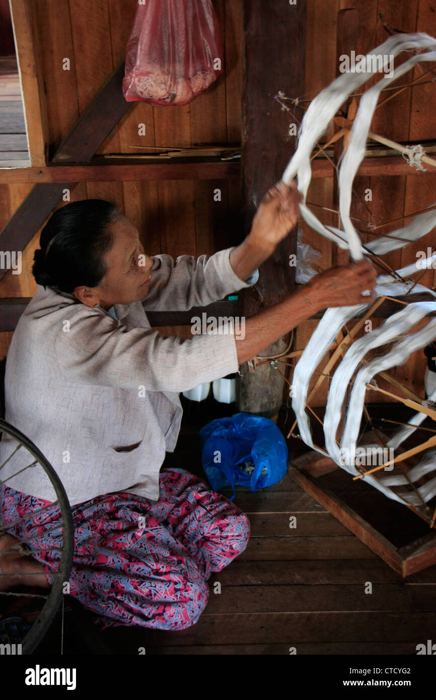 Burmese woman weaving lotus plant threads, Inle lake, Shan state ...