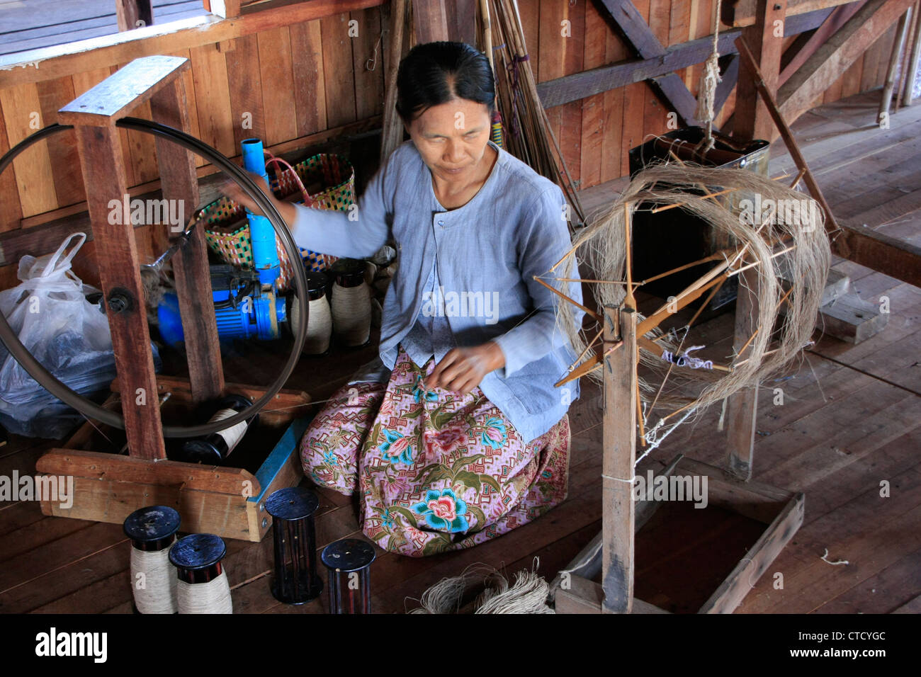 Burmese woman weaving lotus plant threads, Inle lake, Shan state ...