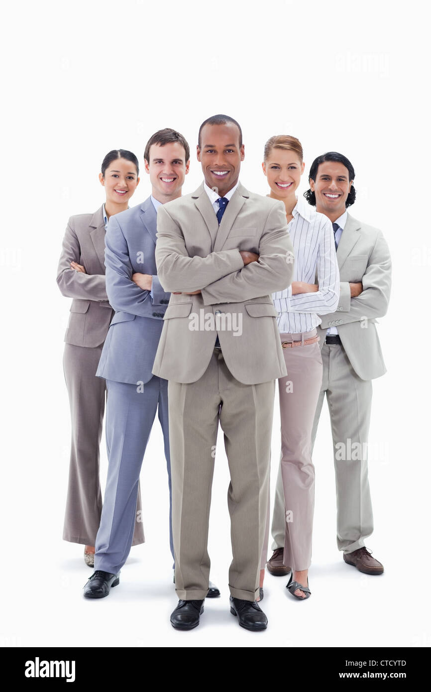 Smiling business team crossing their arms Stock Photo - Alamy