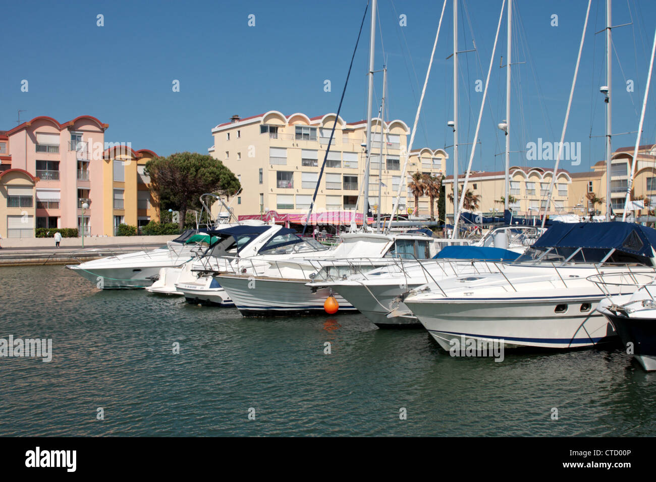 Luxury yachts moored in the modern harbour of Gruissan Languedoc ...