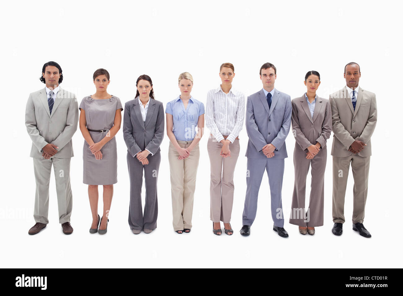 Serious business team side by side holding their hands Stock Photo - Alamy
